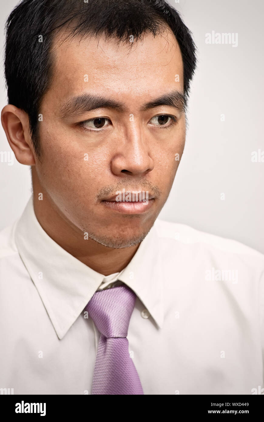 Lonely businessman portrait with closeup face image Stock Photo - Alamy