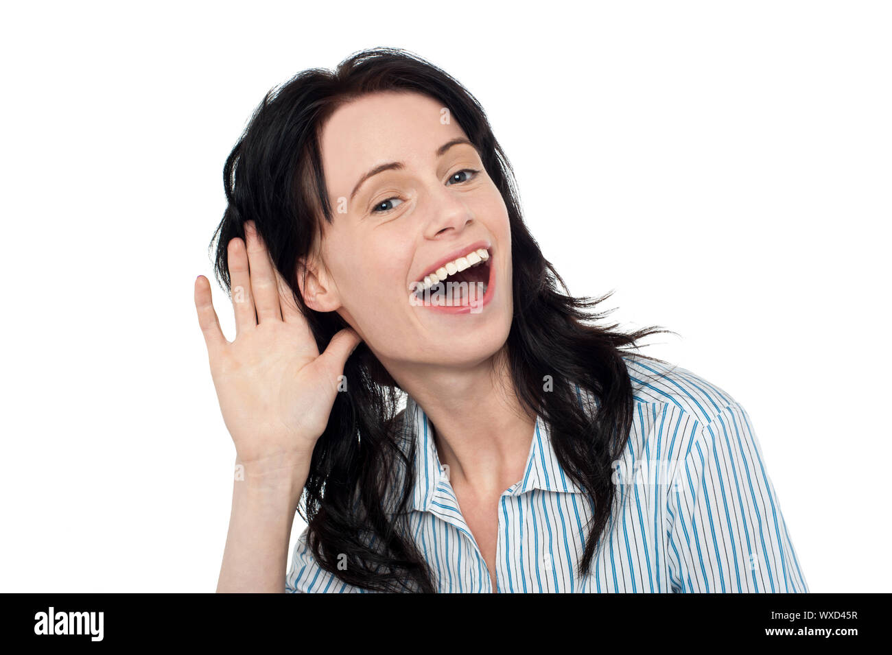Cheerful young woman eavesdropping isolated over white background Stock ...