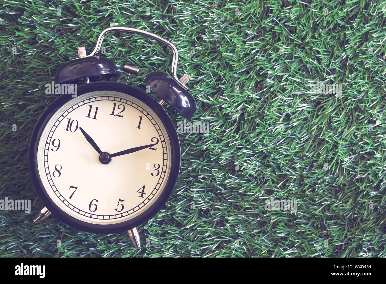 Time management concept, business planning, retro alarm clock on green ...
