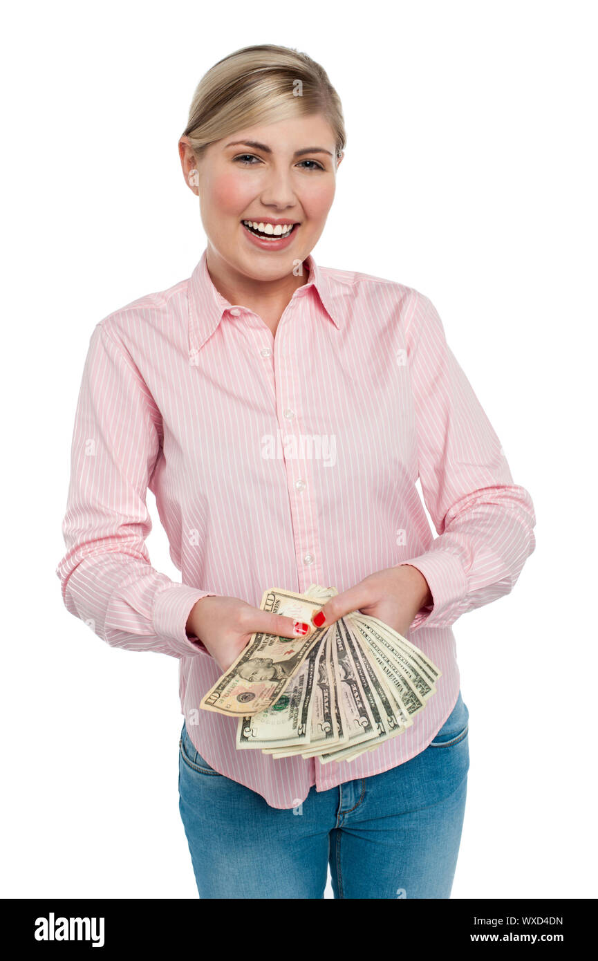 Smiling woman with cash isolated over white background Stock Photo - Alamy