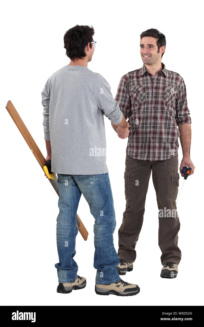 Carpenter shaking hands client hi-res stock photography and images - Alamy