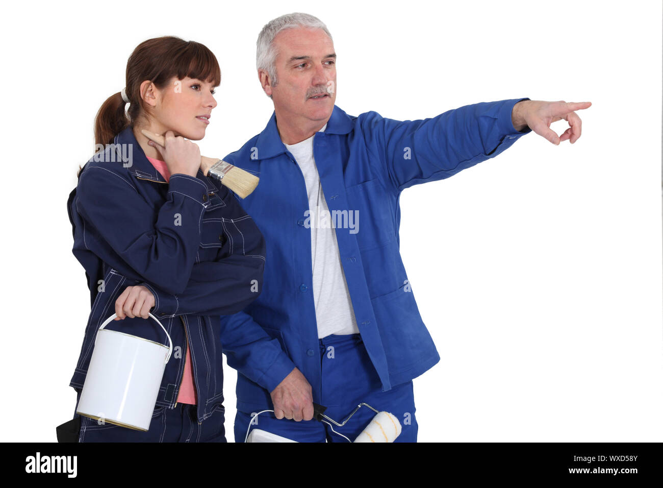 Painter telling his assistant which area to paint Stock Photo - Alamy