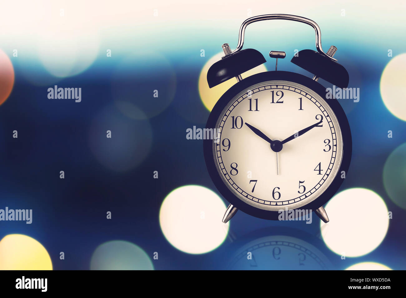 Time management concept, business planning, alarm clock on blue blur ...