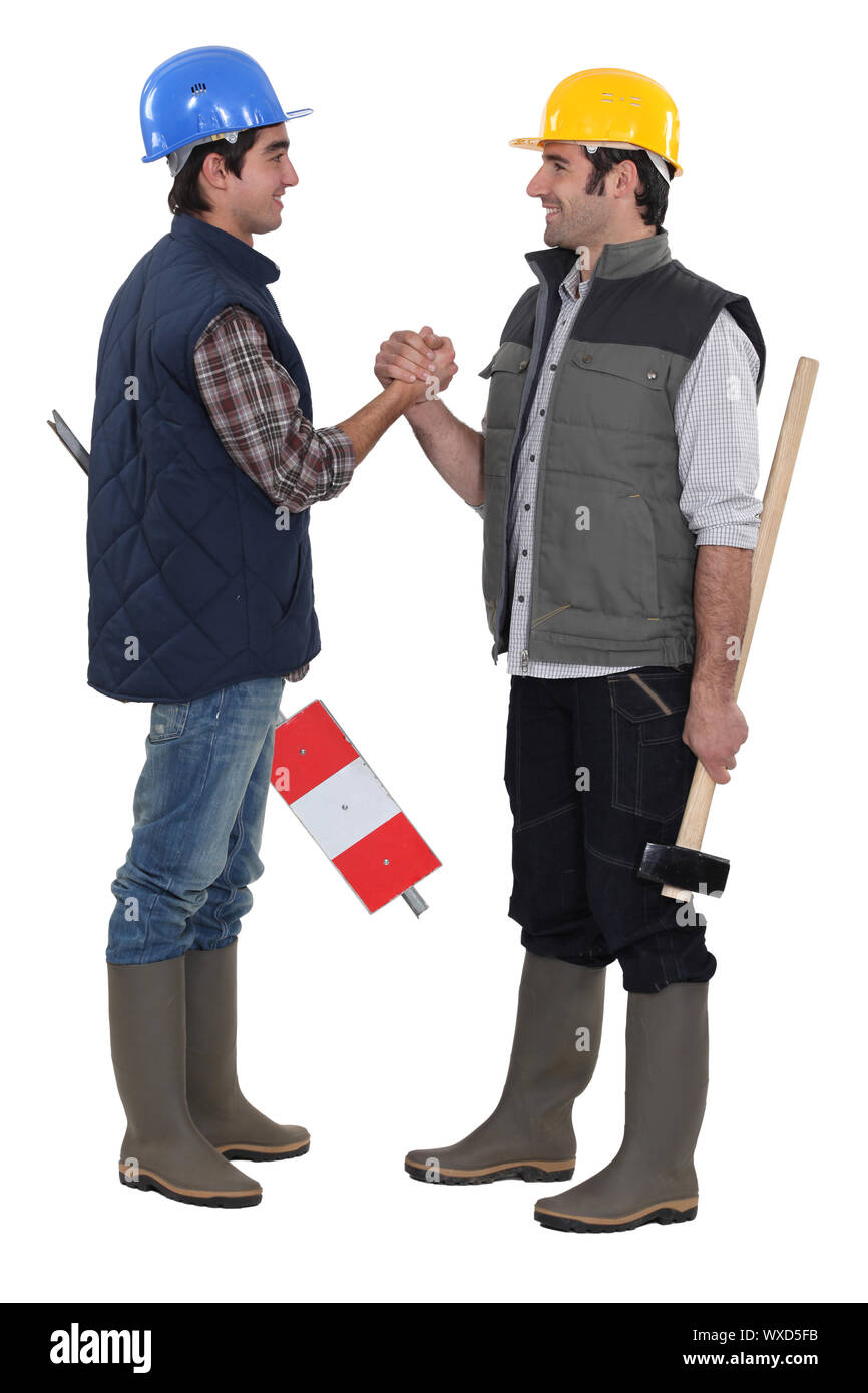 Tradesmen forming a pact Stock Photo - Alamy