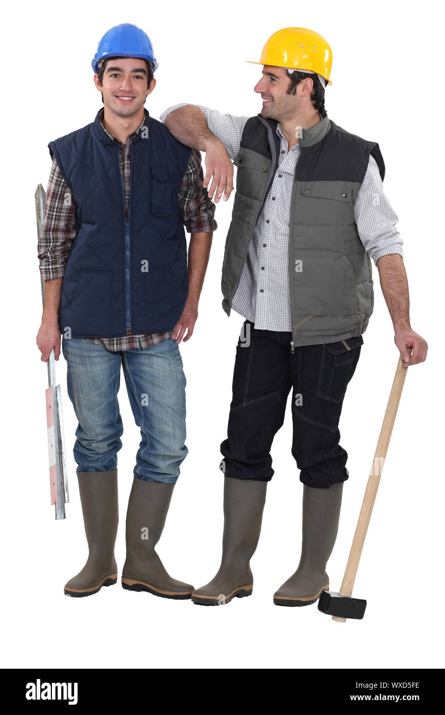 Two manual workers stood together Stock Photo - Alamy