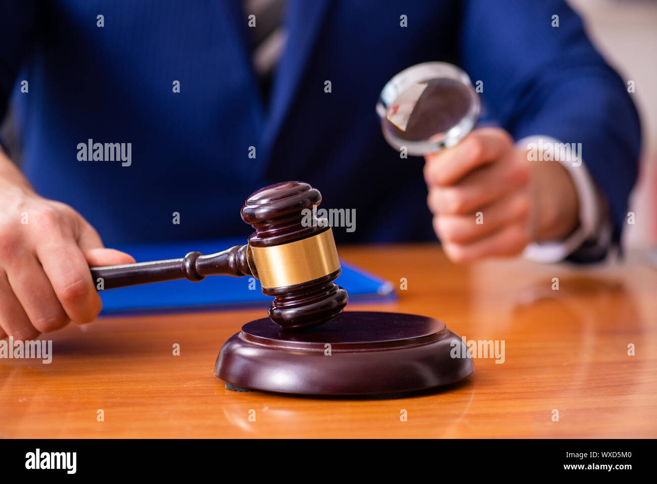 Young male judge sitting in courtroom Stock Photo - Alamy