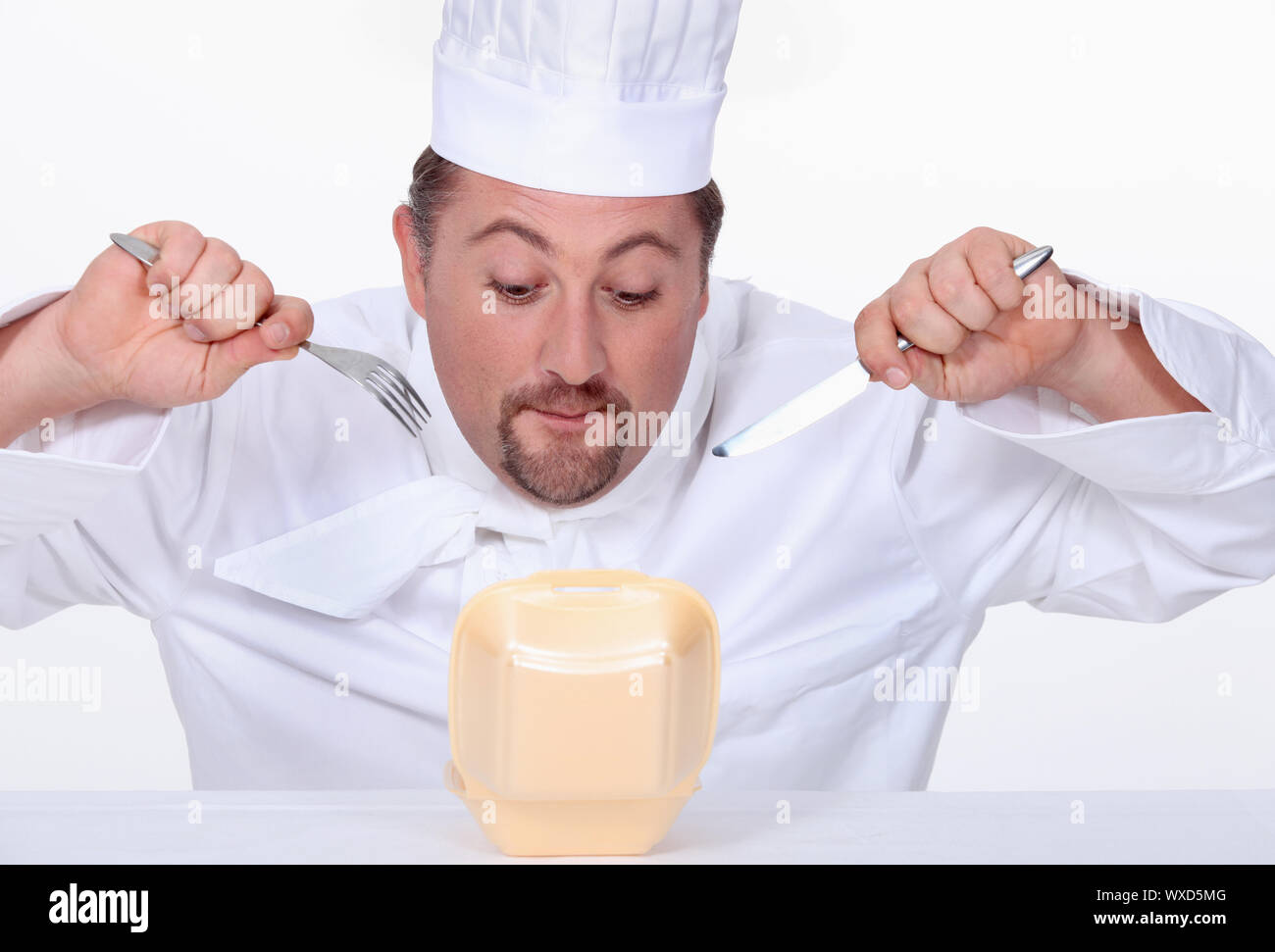 Chef eating junk food Stock Photo - Alamy
