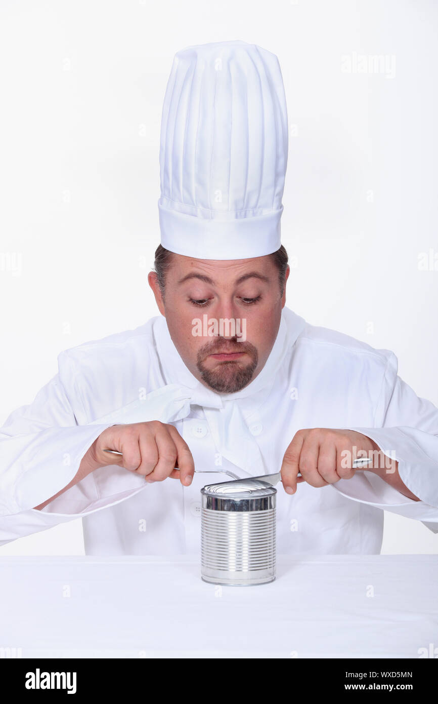 Chef eating a tin can Stock Photo - Alamy