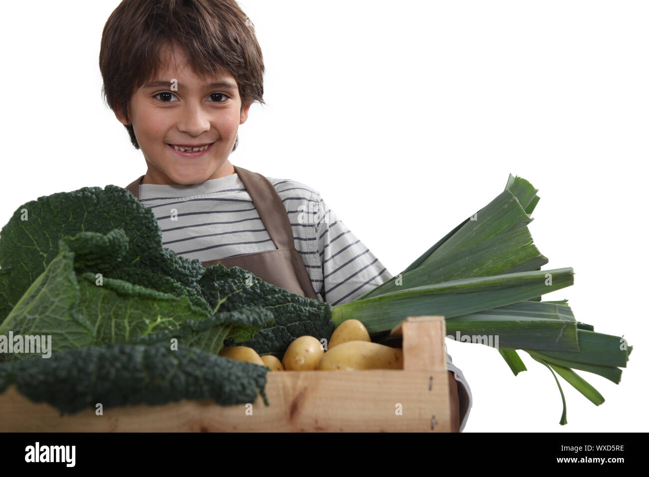Young boy with a box full of fresh produce Stock Photo - Alamy