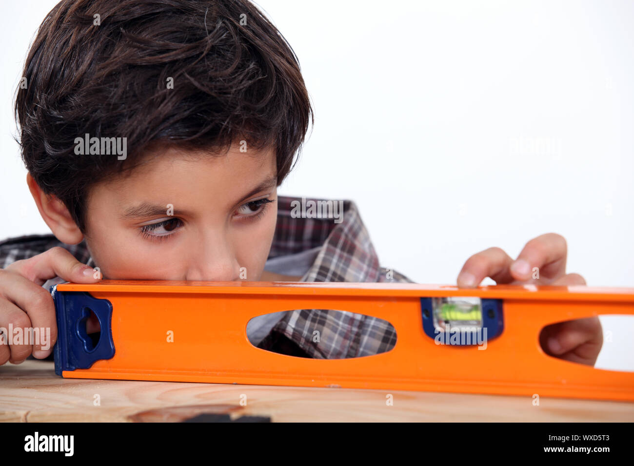 Boy with a spirit level Stock Photo - Alamy