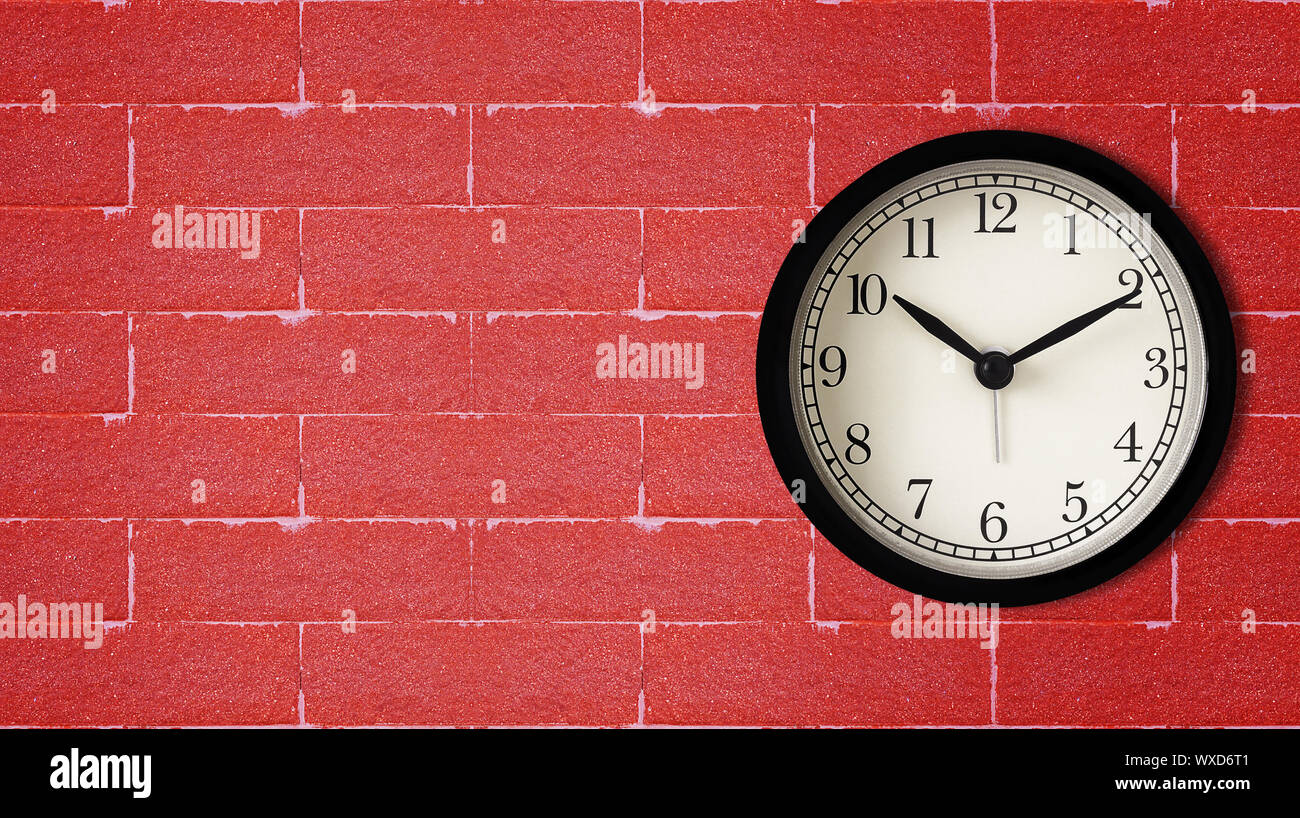 Time management concept, business planning, round clock on red brick ...