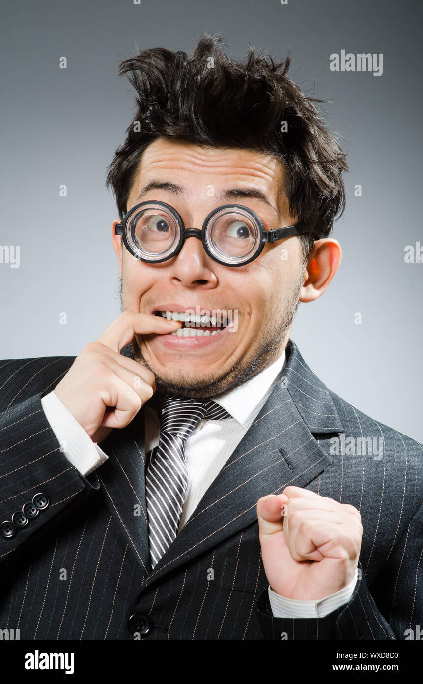 Funny nerd businessman in dark studio Stock Photo - Alamy
