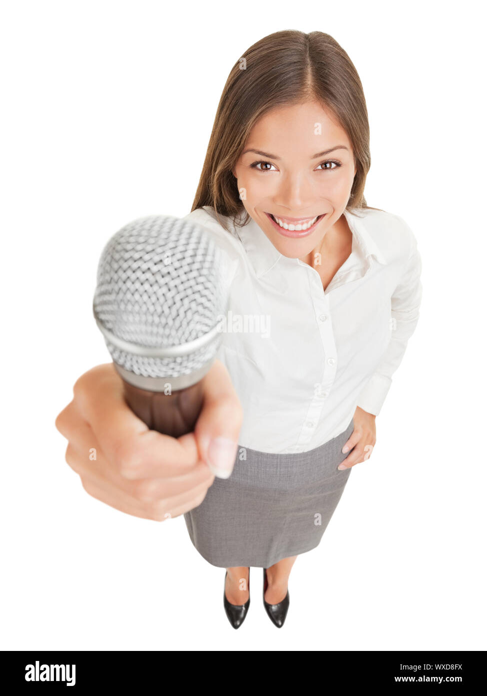 Fun high angle perspective of a beautiful smiling young woman offering ...