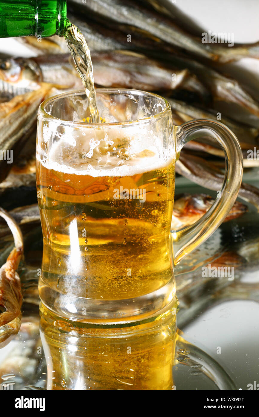 golden beer splash in glass Stock Photo - Alamy