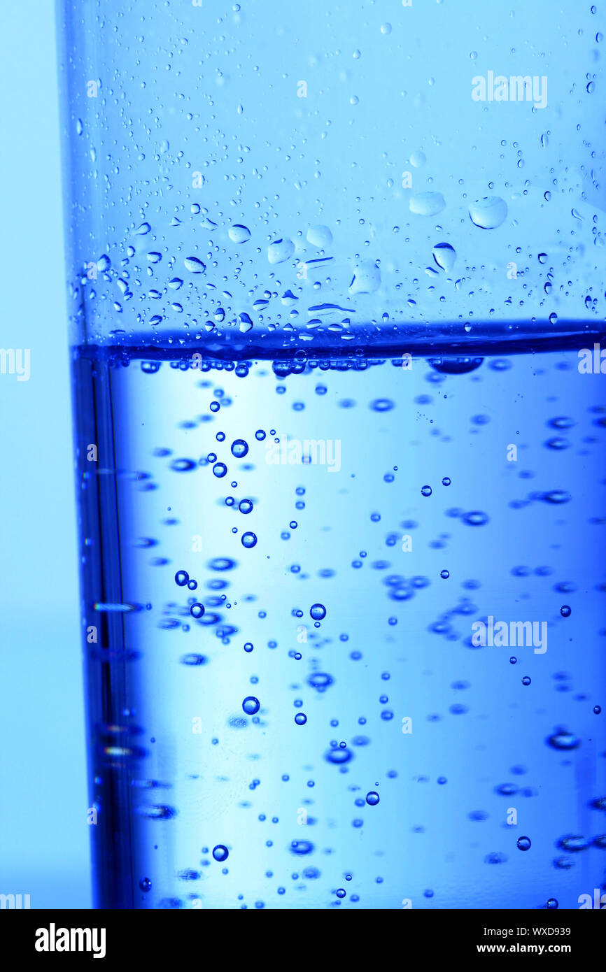 blue bubbled water in glass Stock Photo - Alamy