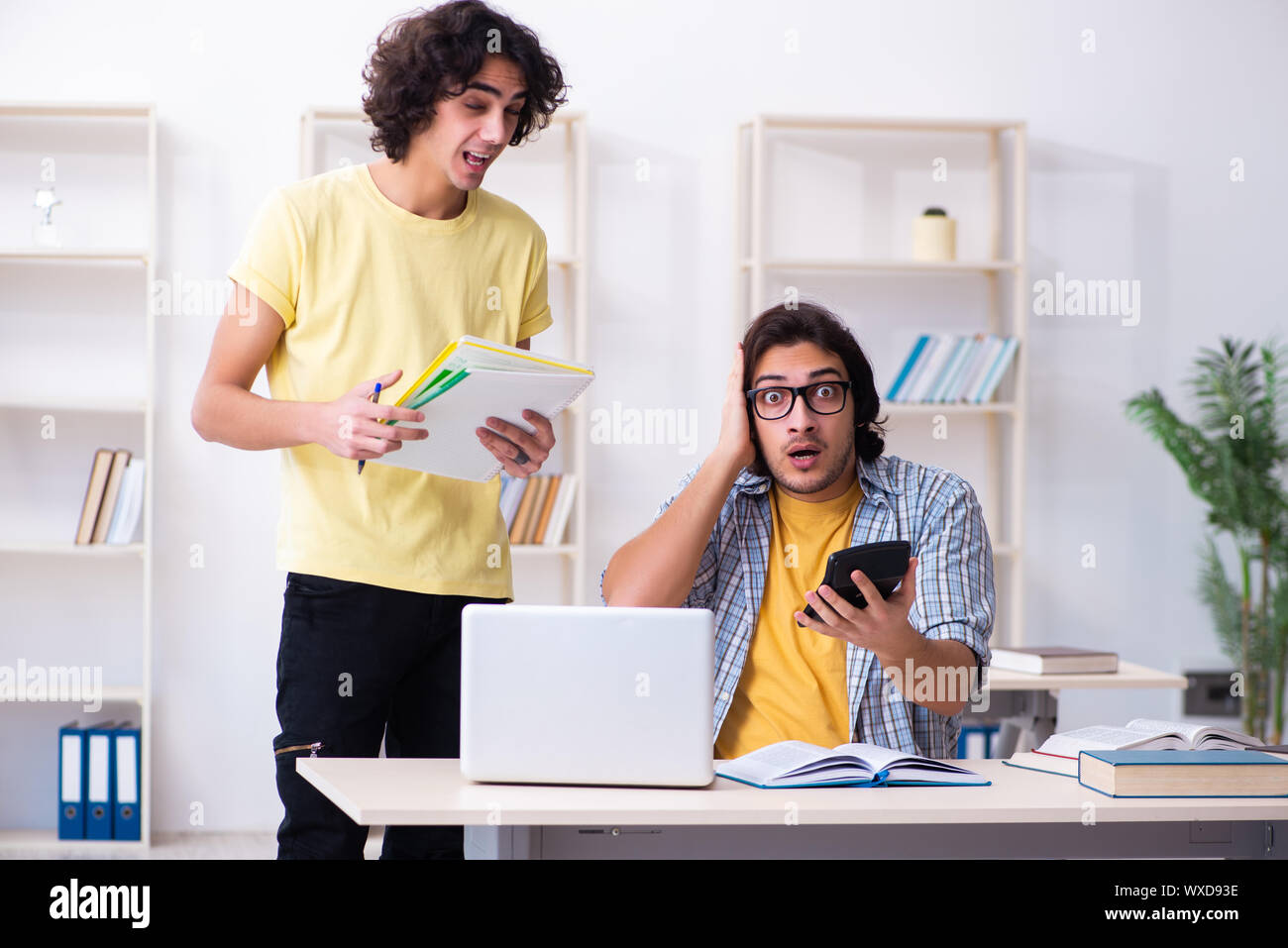Two male students in the classroom Stock Photo - Alamy