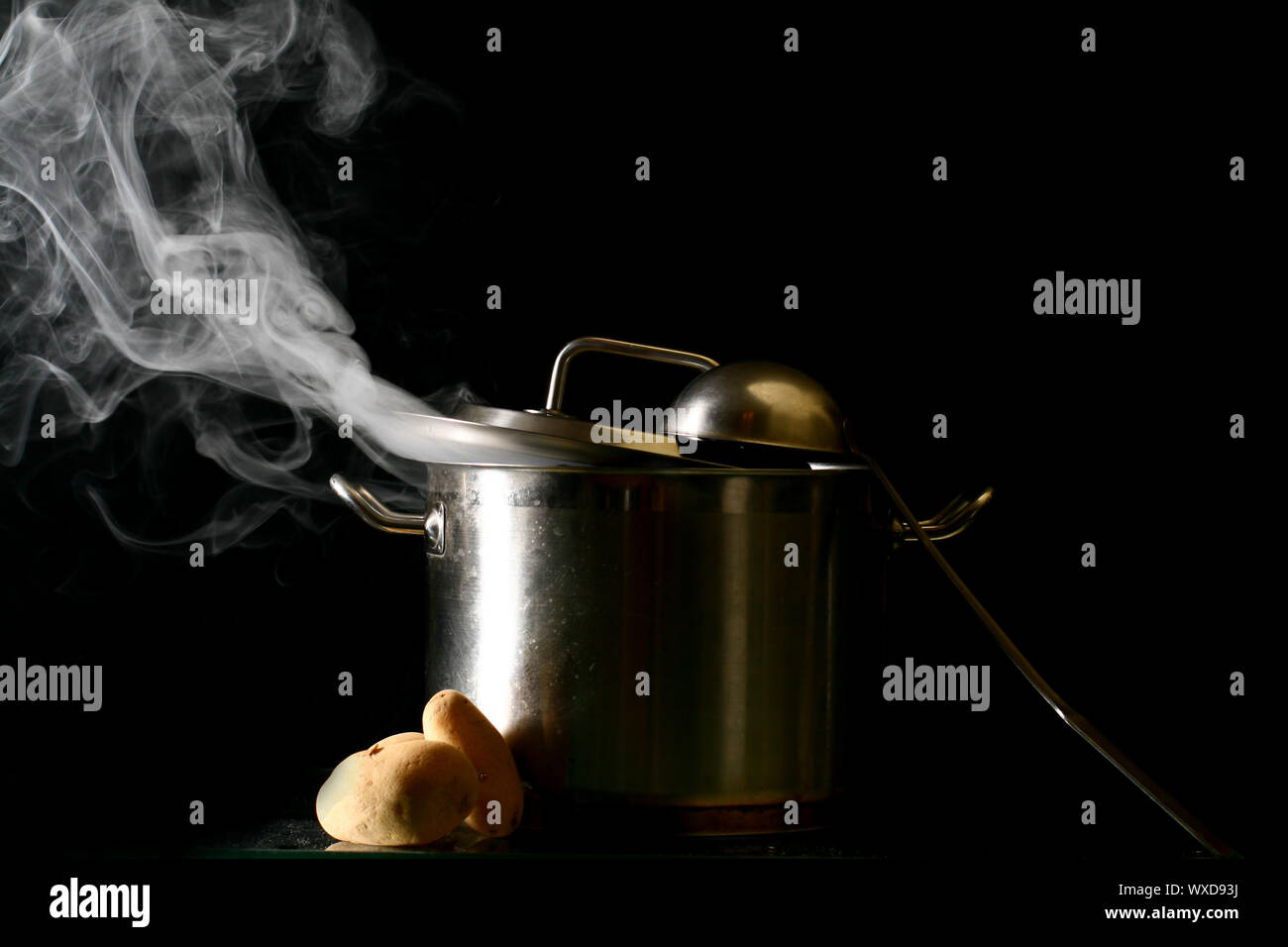 big pan and smoke on black Stock Photo - Alamy
