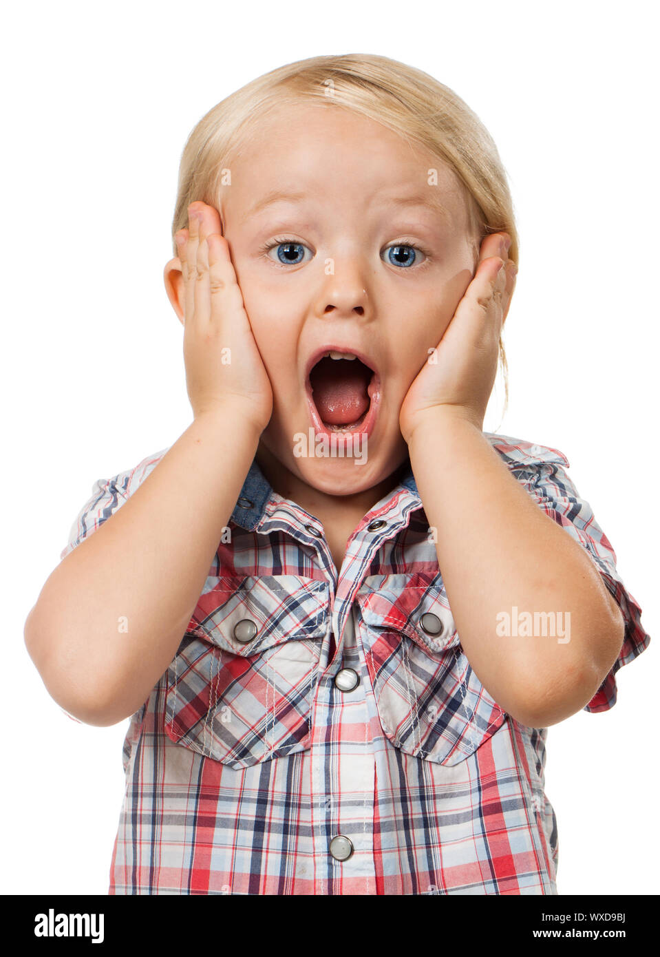 A very cute young surprised boy looking at camera, Isolated on white ...
