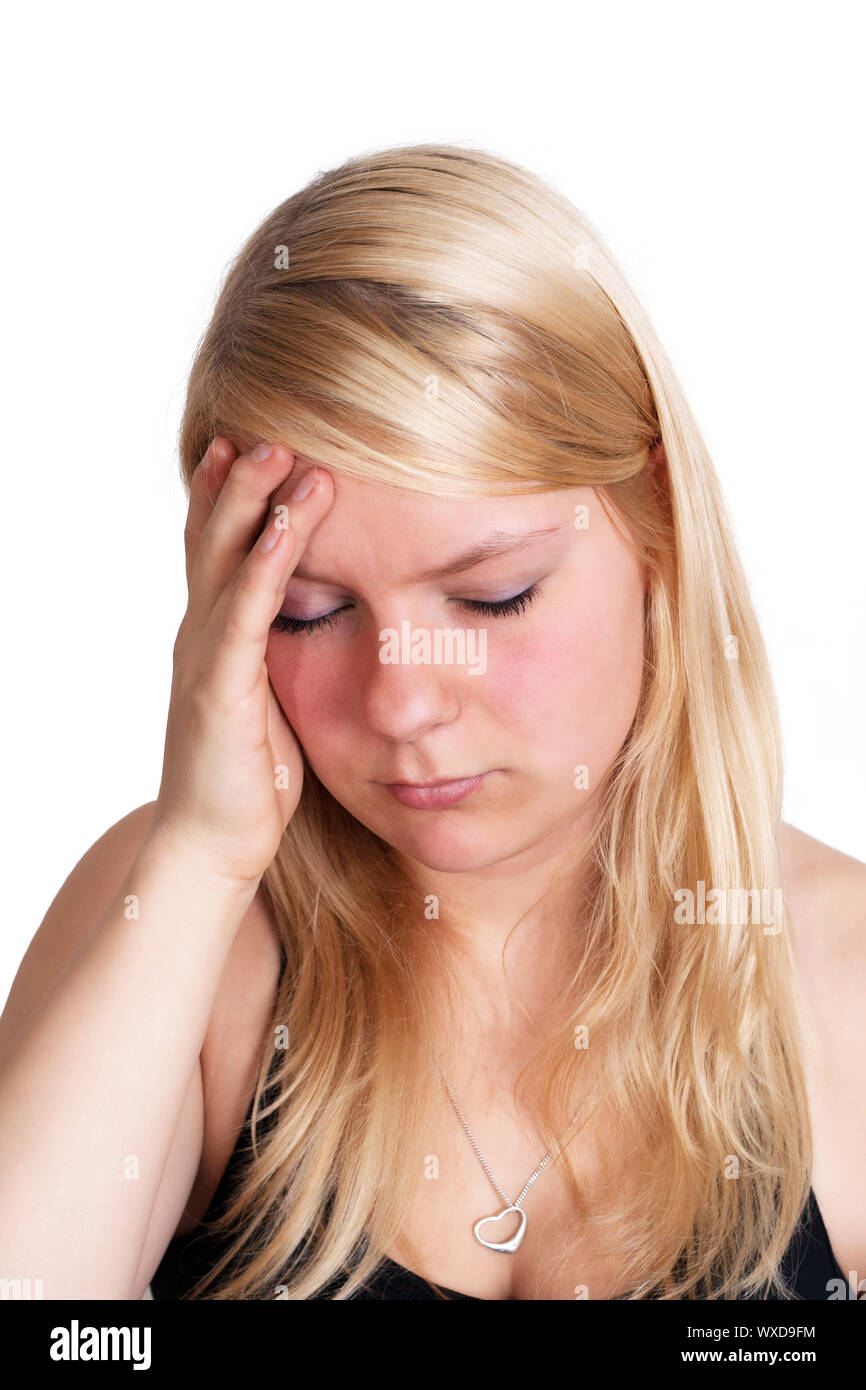 young blonde woman with splitting headache - isolated on white ...