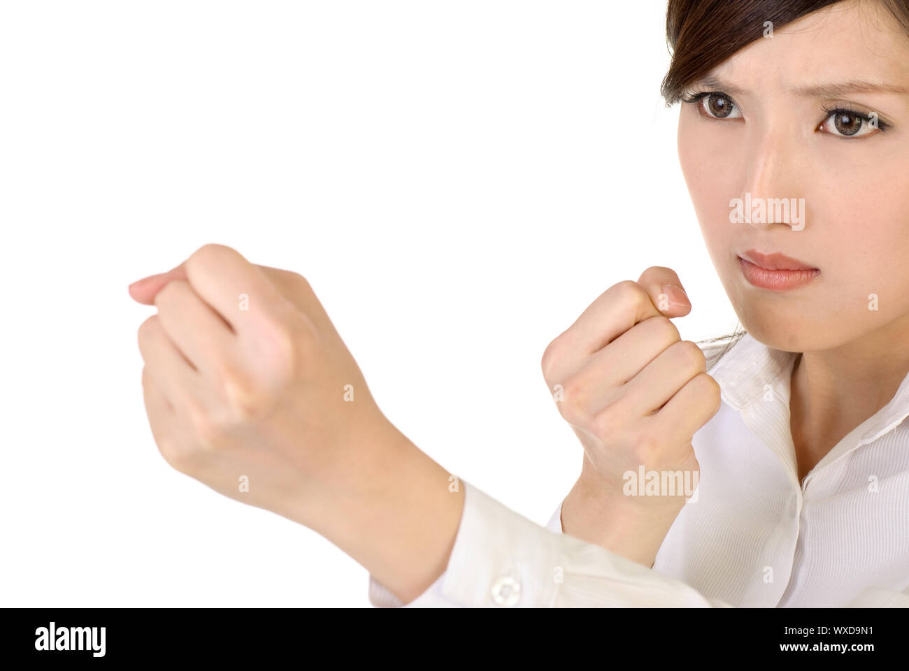 Businesswoman fight pose with confident expression on white background ...