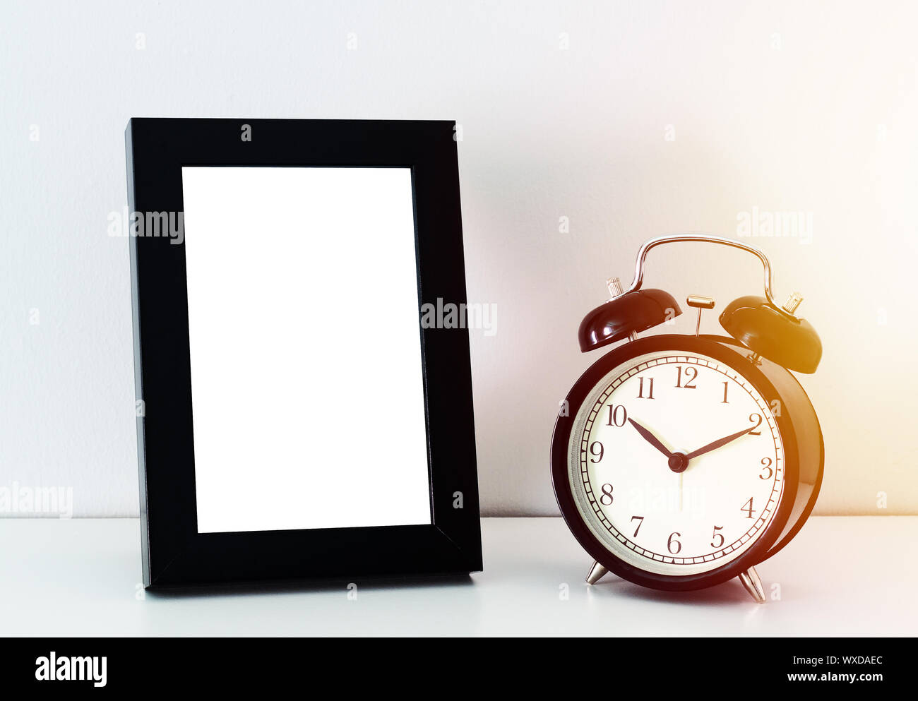 Desktop or table frame and retro alarm clock, time and memory concept ...