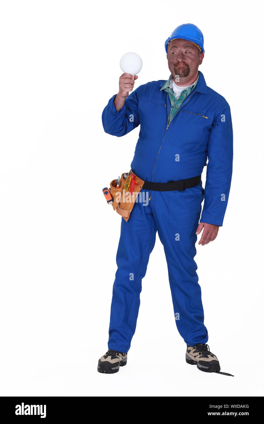 Shocked man holding light bulb Stock Photo - Alamy
