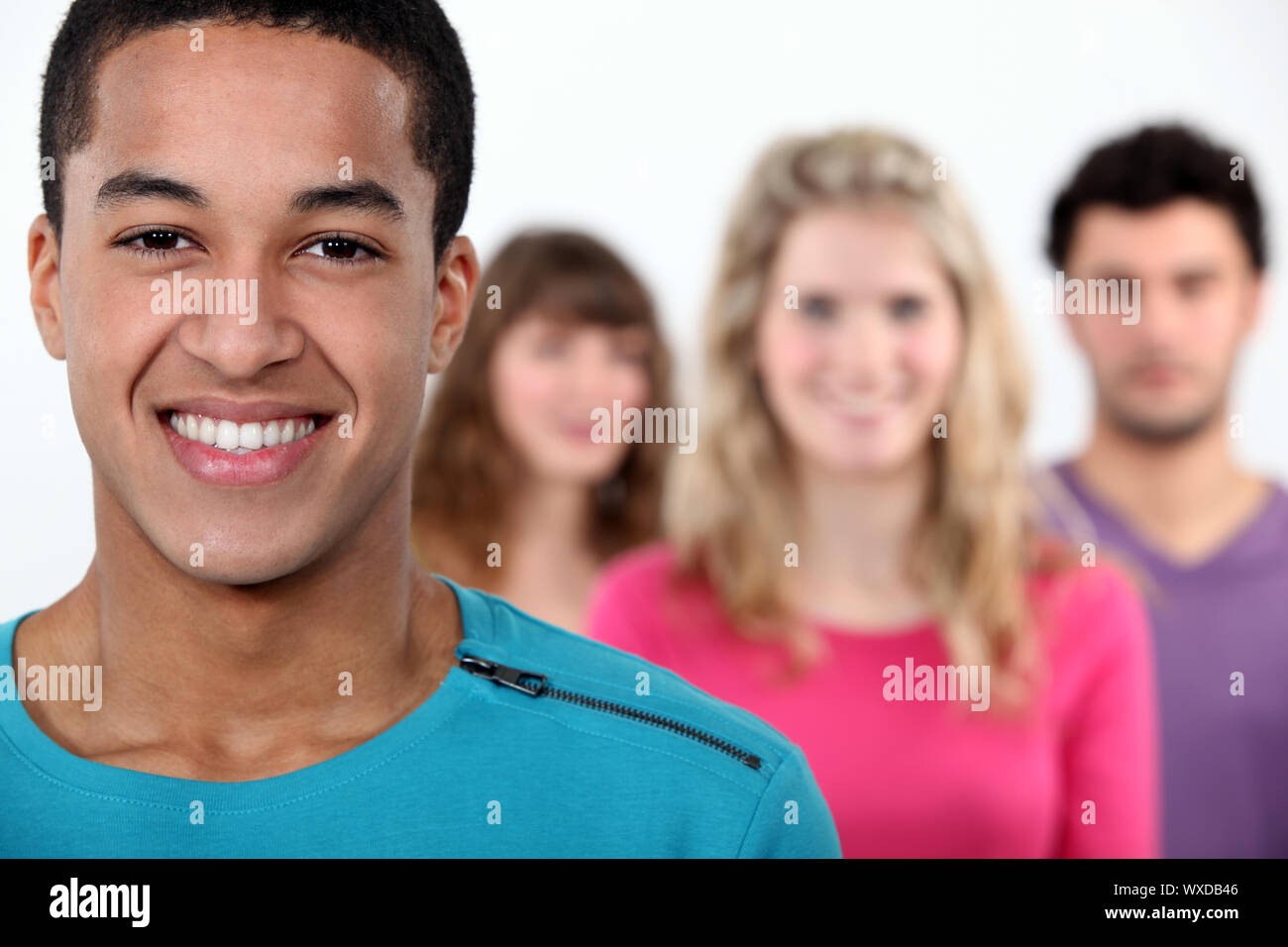 Four friends stood on white background Stock Photo - Alamy