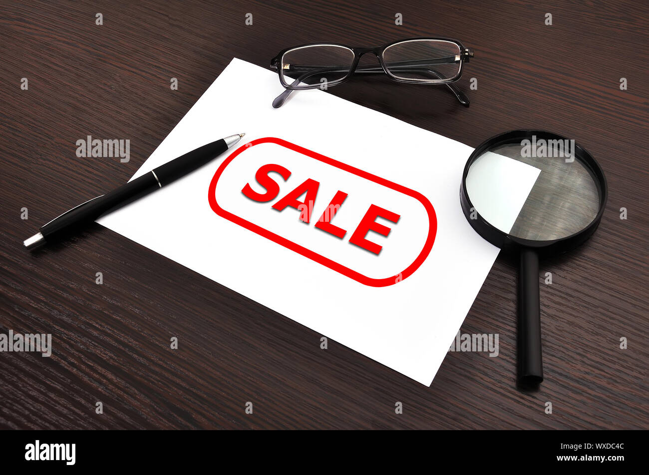 workplace with sale symbol on paper Stock Photo - Alamy
