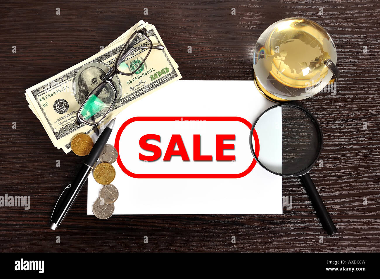 workplace with sale symbol on paper Stock Photo - Alamy