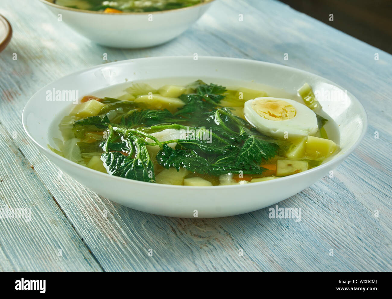 Spring vegetable soup nettle with egg Stock Photo - Alamy