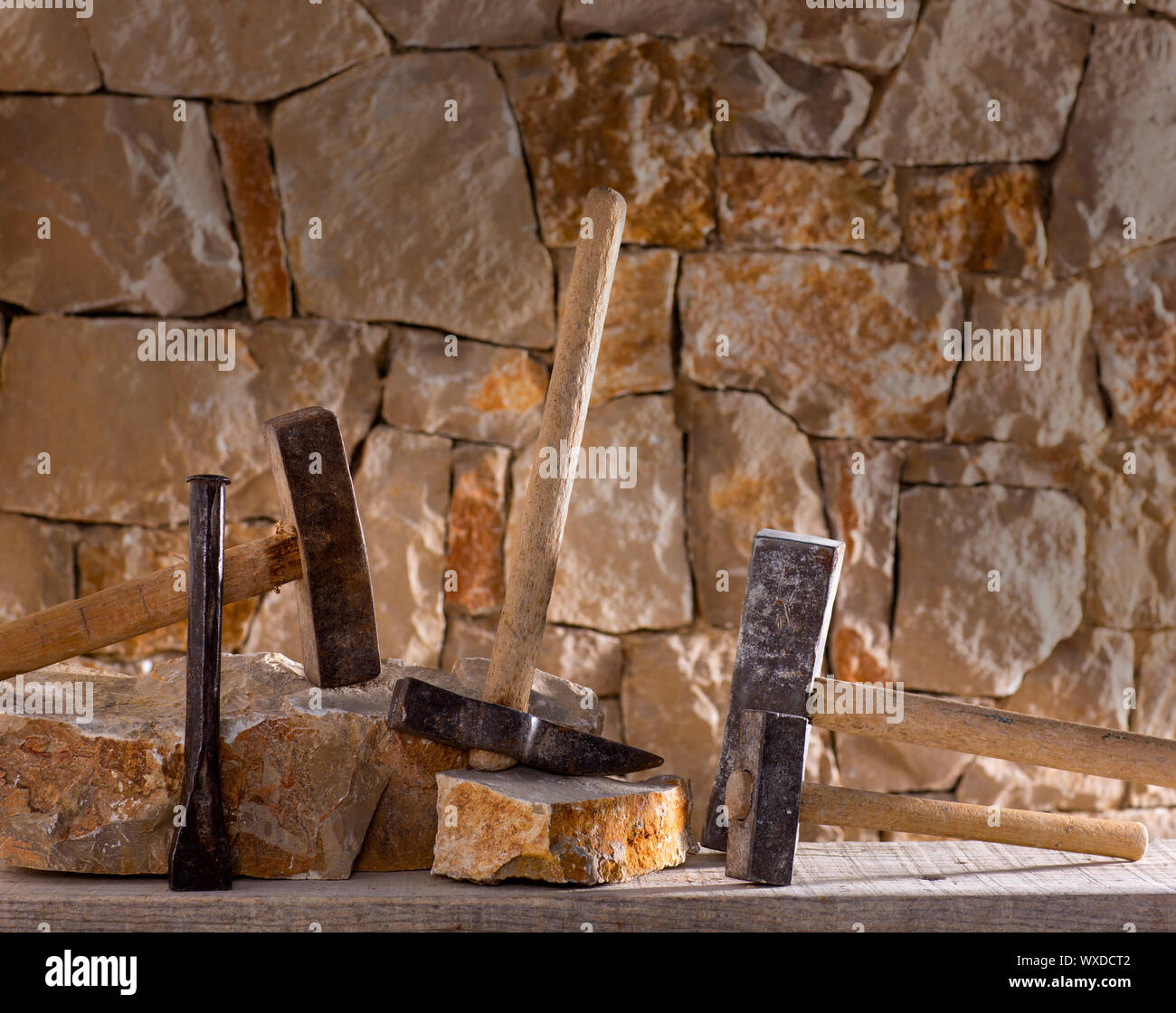 Hammer mason tools of stonecutter masonry work in a contruction stone ...