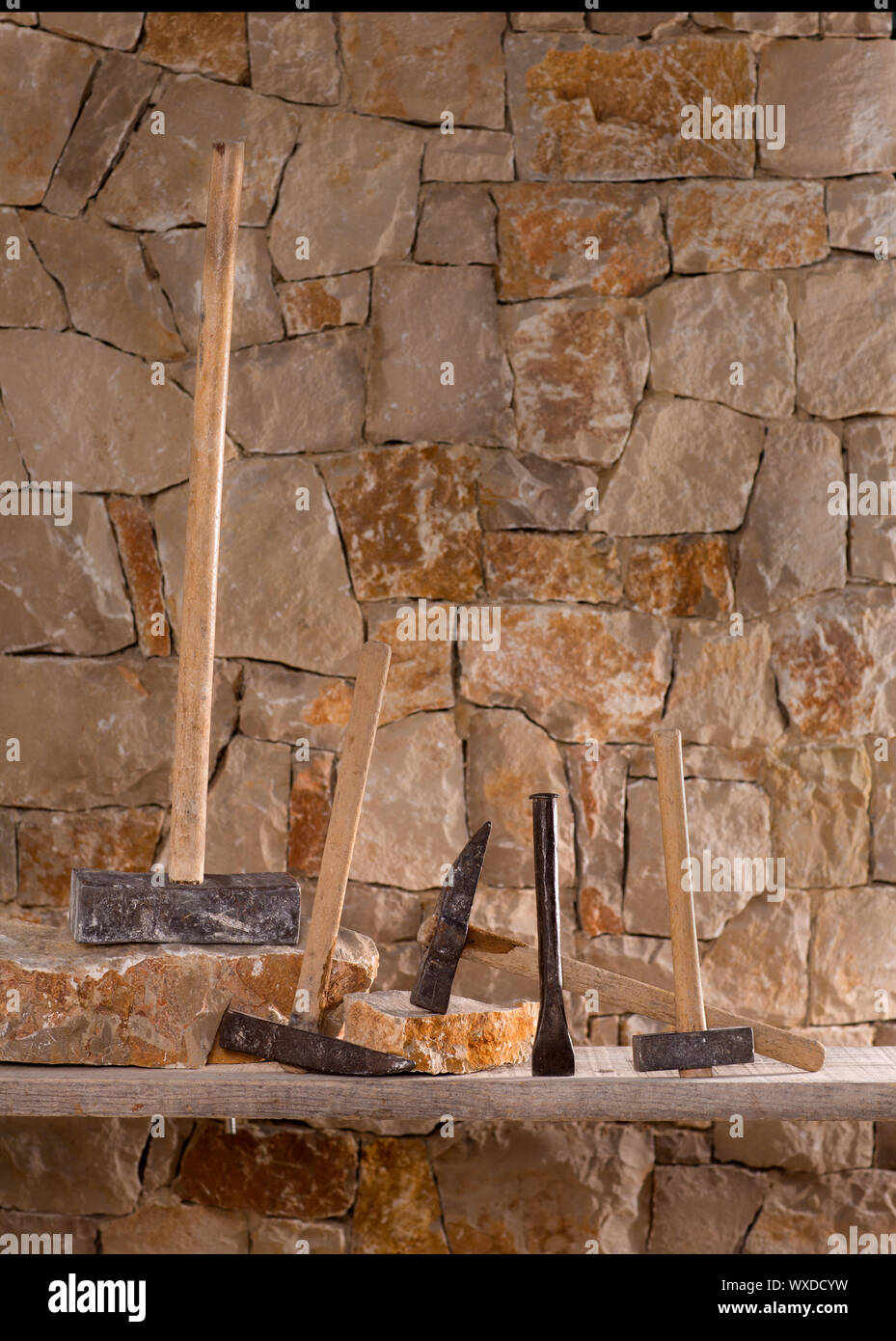 Hammer mason tools of stonecutter masonry work in a contruction stone ...