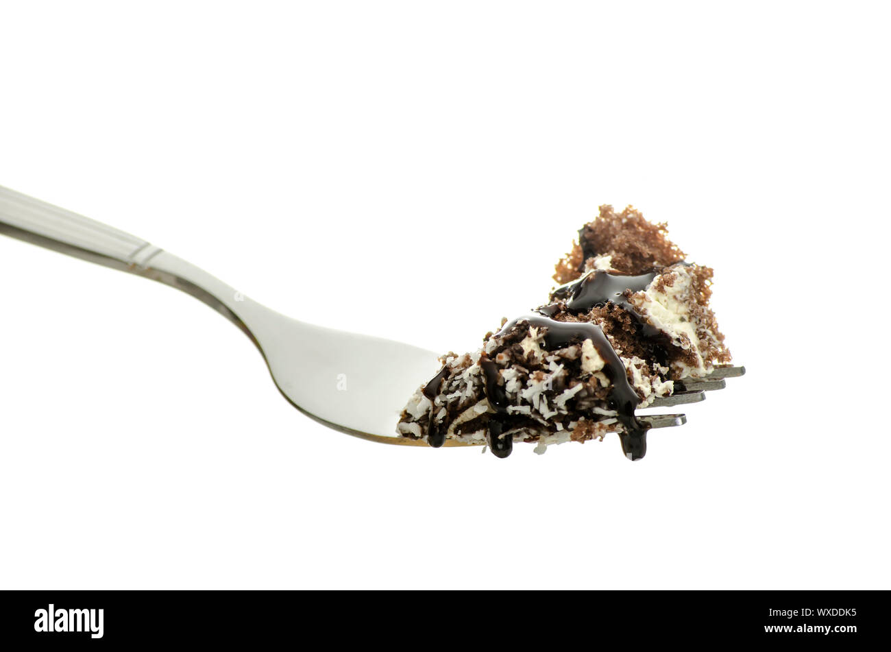 Small piece of delicious cake on a fork with liquid chocolate dropping ...