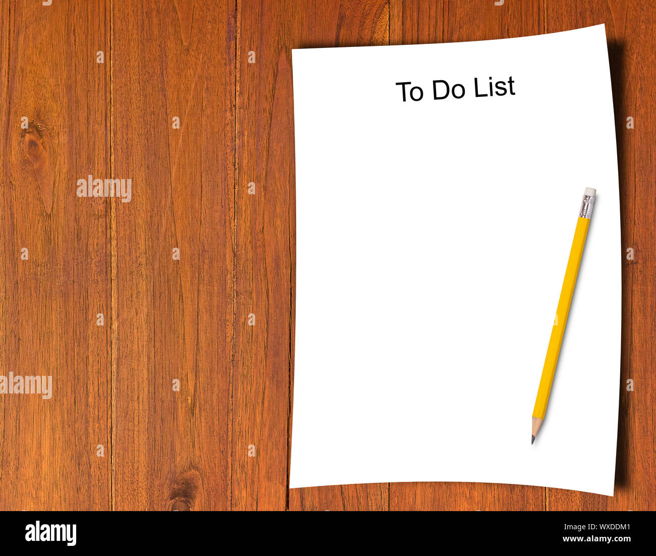 To do list concept, white paper and yellow pencil on wood background ...
