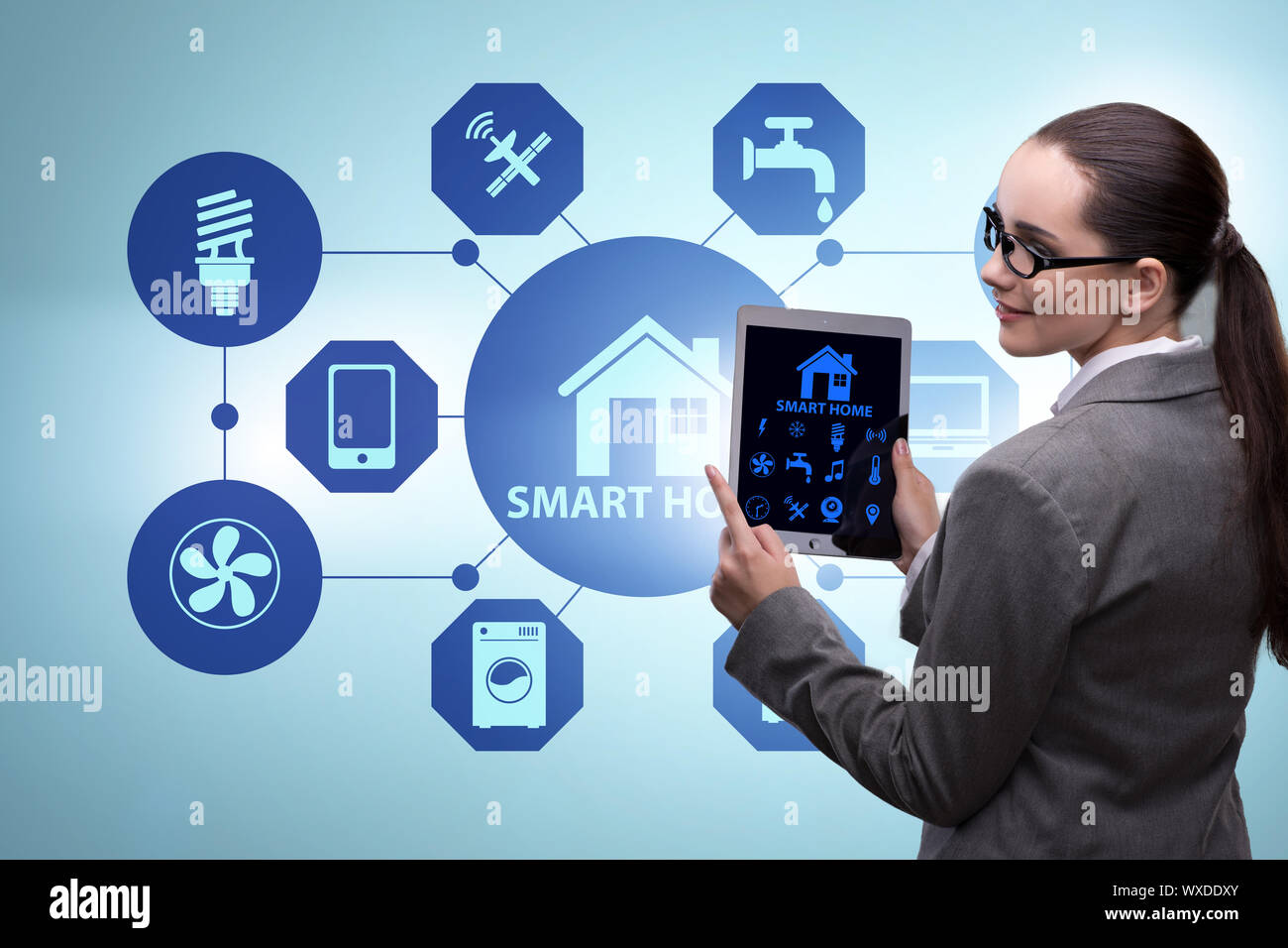 Smart home concept with woman Stock Photo - Alamy