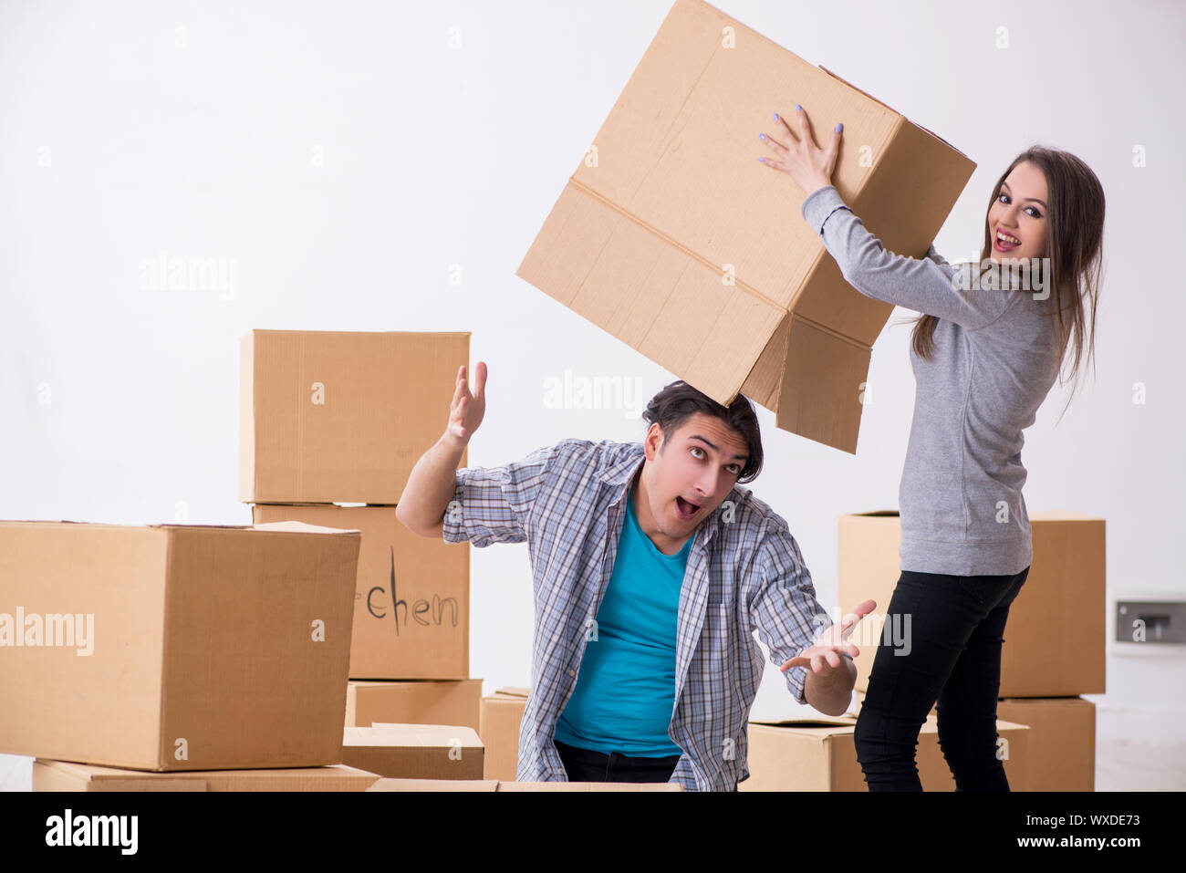 Young pair moving to new flat Stock Photo - Alamy