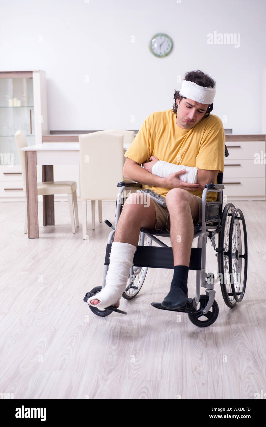 Young man after accident recovering at home Stock Photo - Alamy