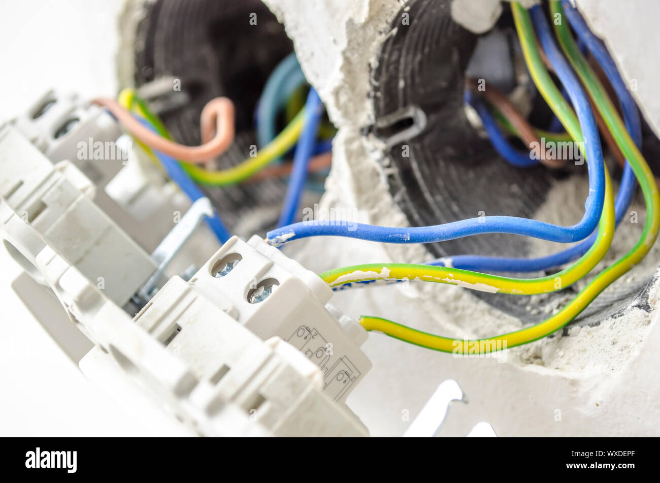 Opened light switch with electrical wires hanging of the wall Stock ...