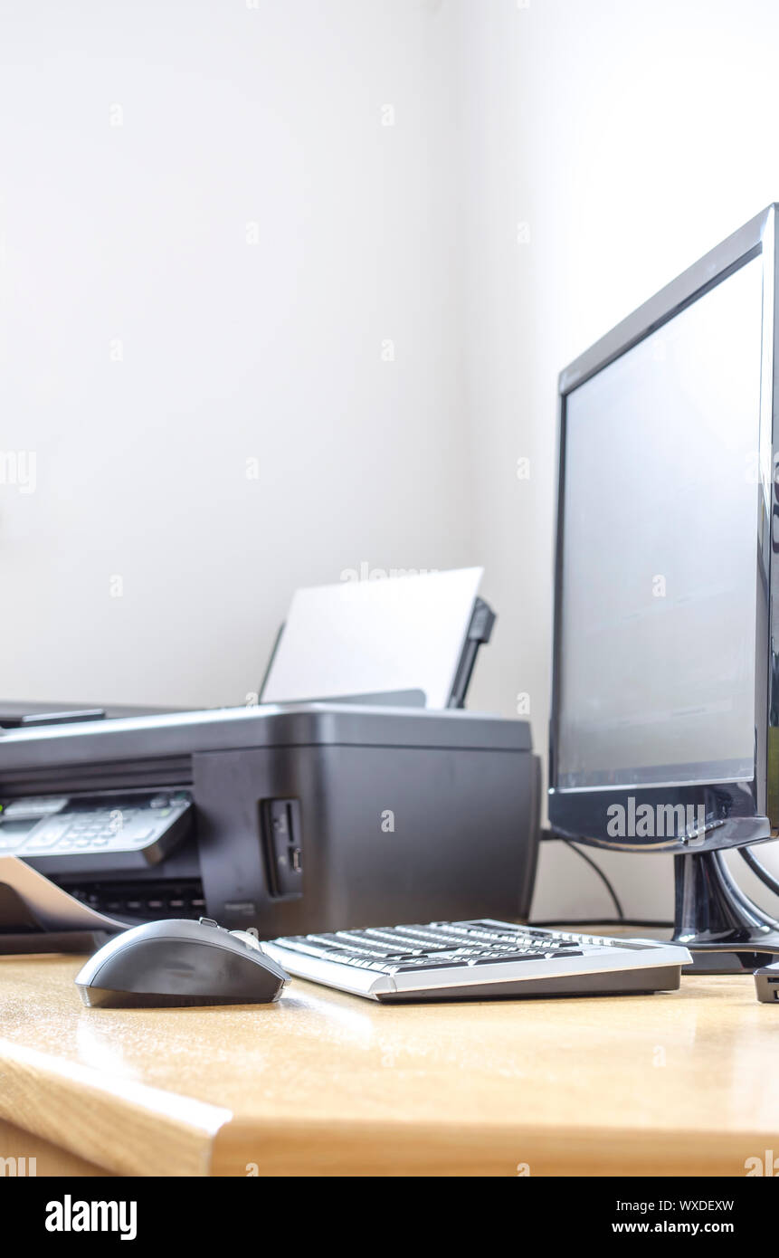 Wooden office desk with computer and printer Stock Photo - Alamy
