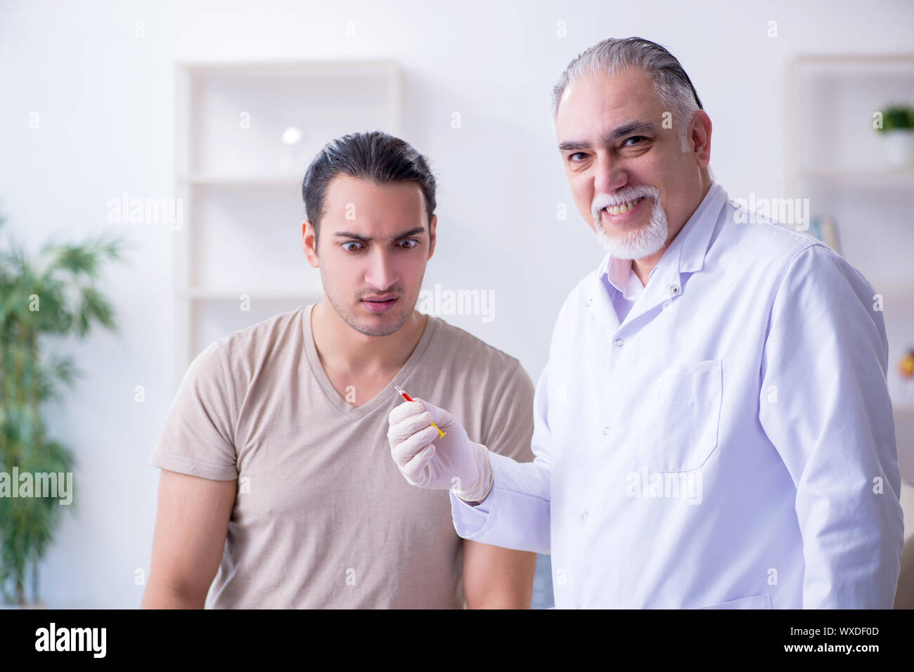 Male patient visitng doctor hi-res stock photography and images - Alamy