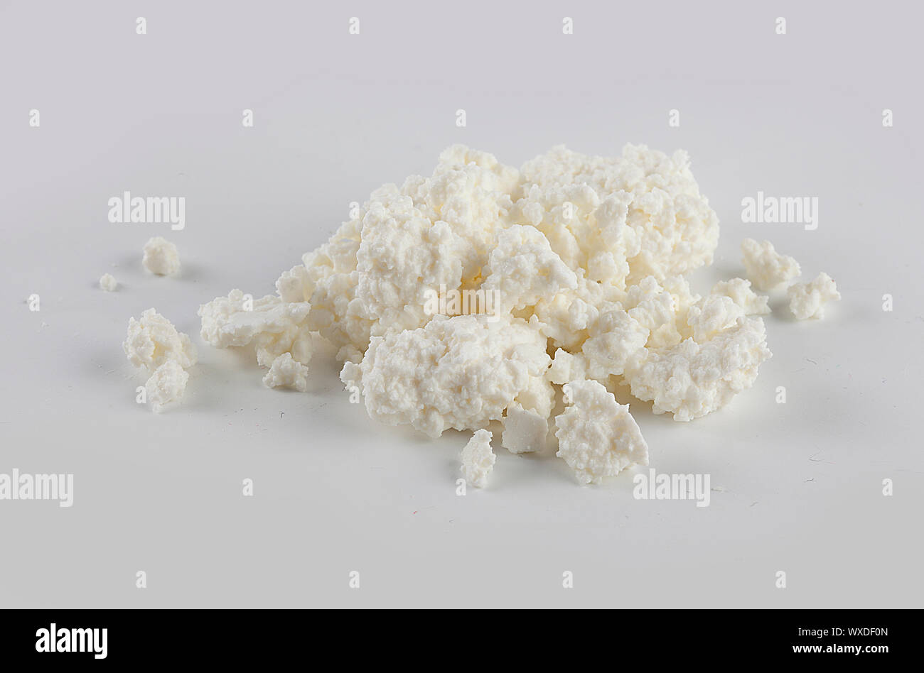 Handful of cottage cheese on the grey background Stock Photo - Alamy