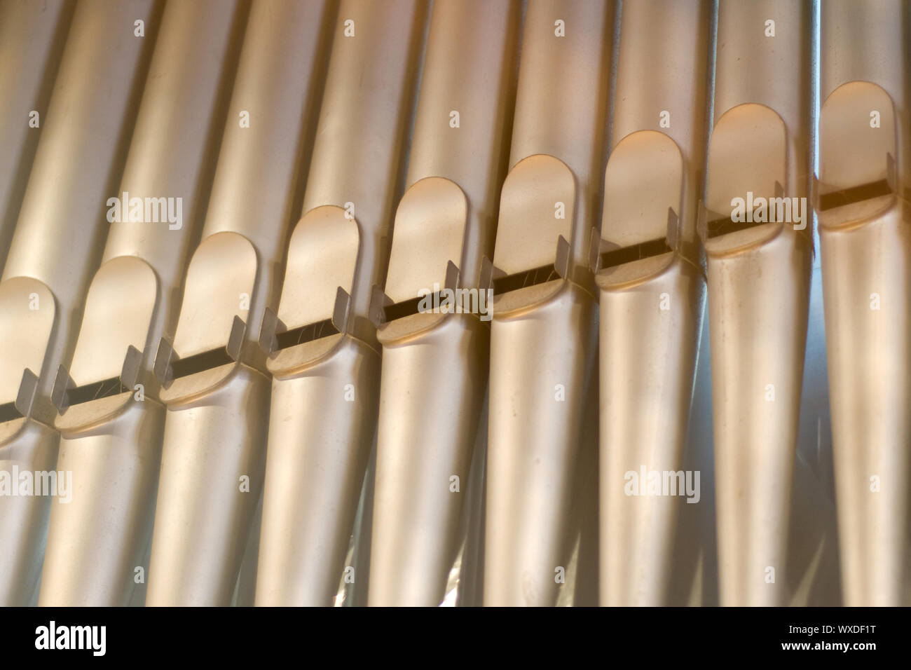 copper organ pipes for music in the church Stock Photo - Alamy