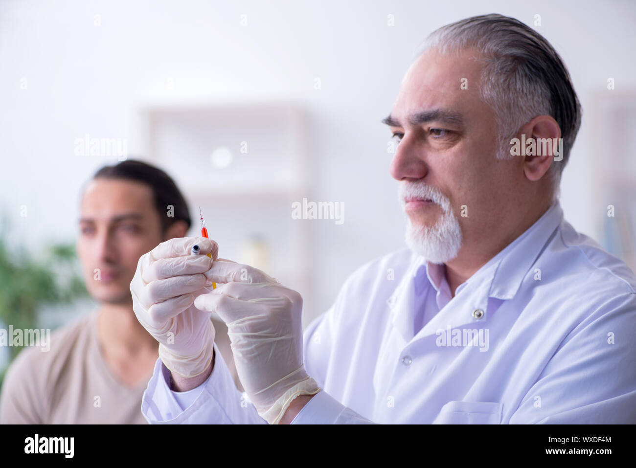 Male patient visitng doctor hi-res stock photography and images - Alamy