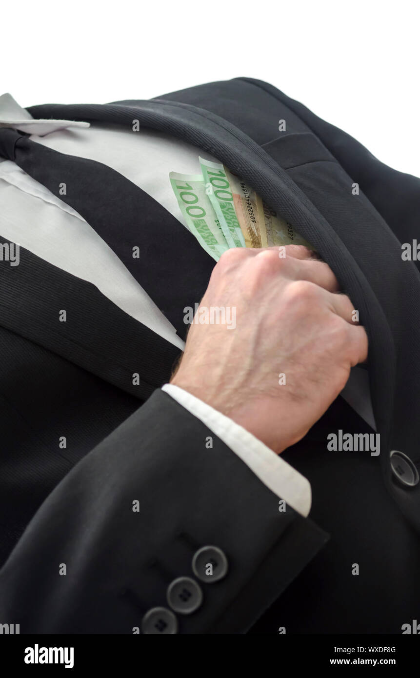 Businessman putting banknotes in his jacket pocket Stock Photo - Alamy