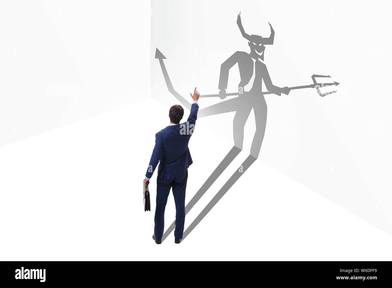 Devil hiding in the businessman - alter ego concept Stock Photo - Alamy