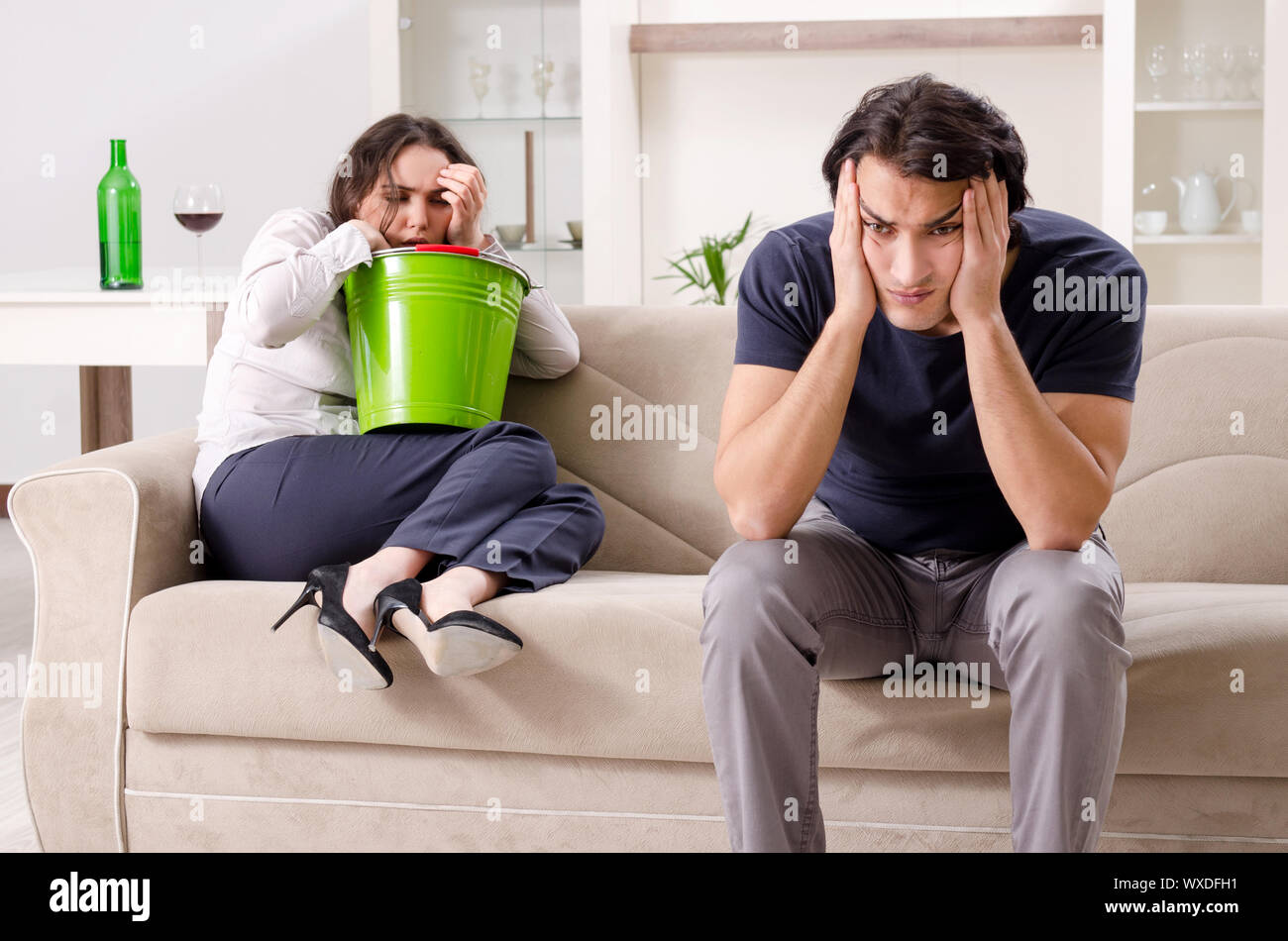 Young wife suffering from sick stomach and vomiting Stock Photo - Alamy
