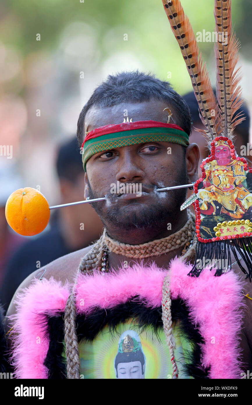 SINGAPORE - JANUARY 27: Male Hindu devotee carrying a kavadi at ...