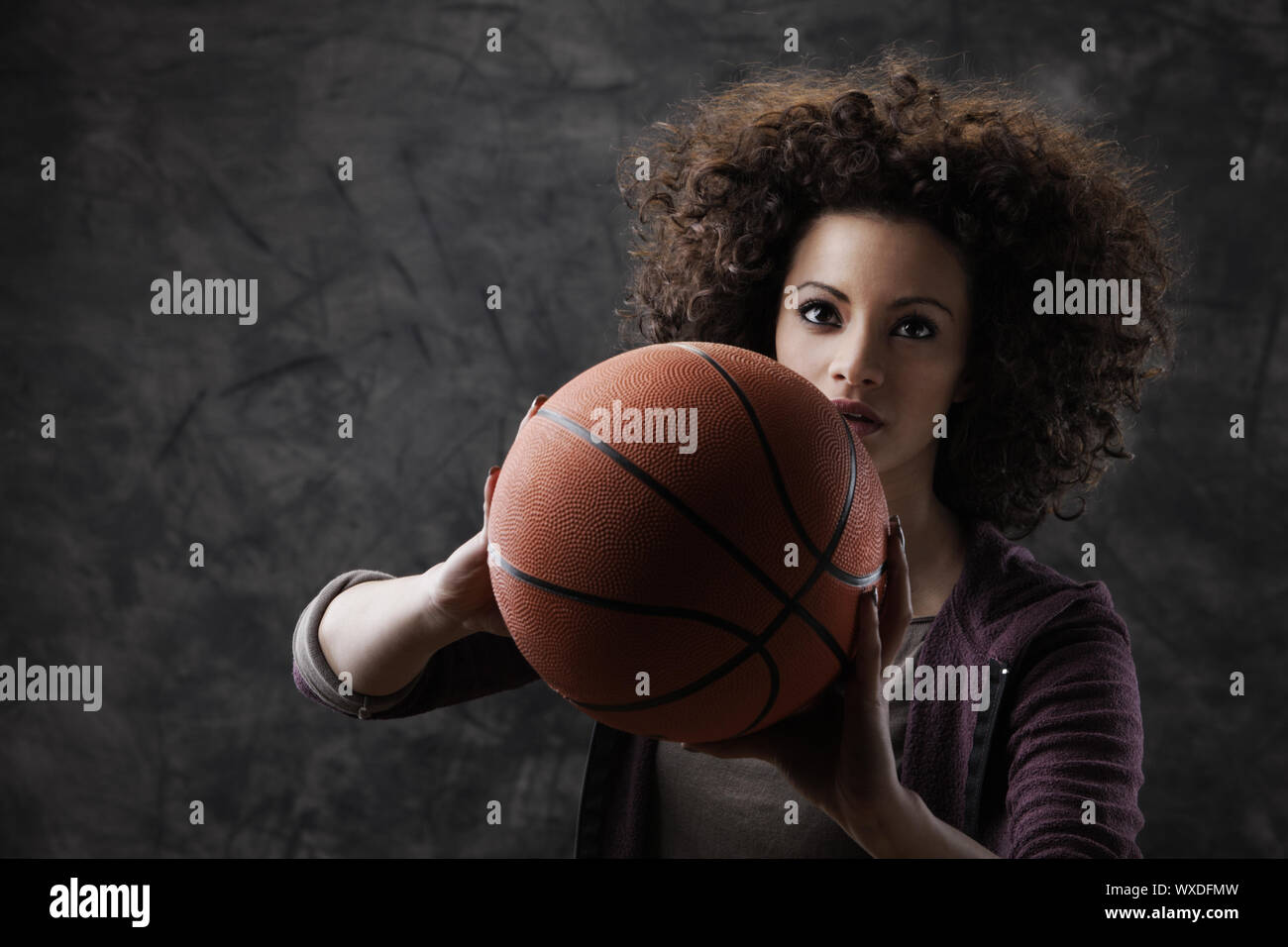 Closeup of young woman shooting a basketball Stock Photo - Alamy