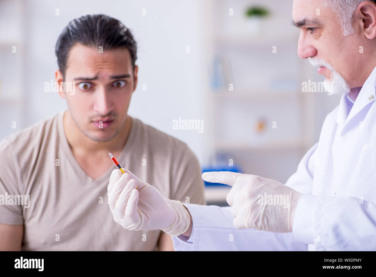 Male patient visitng doctor hi-res stock photography and images - Alamy