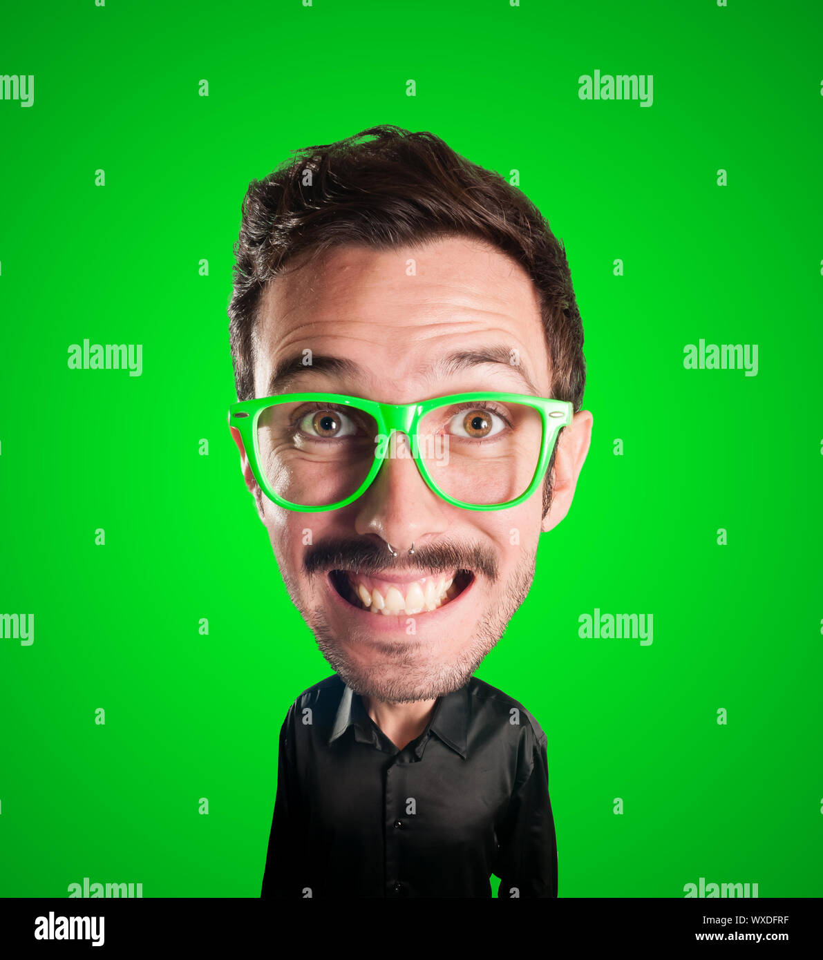 puppet man with big head on green background Stock Photo - Alamy